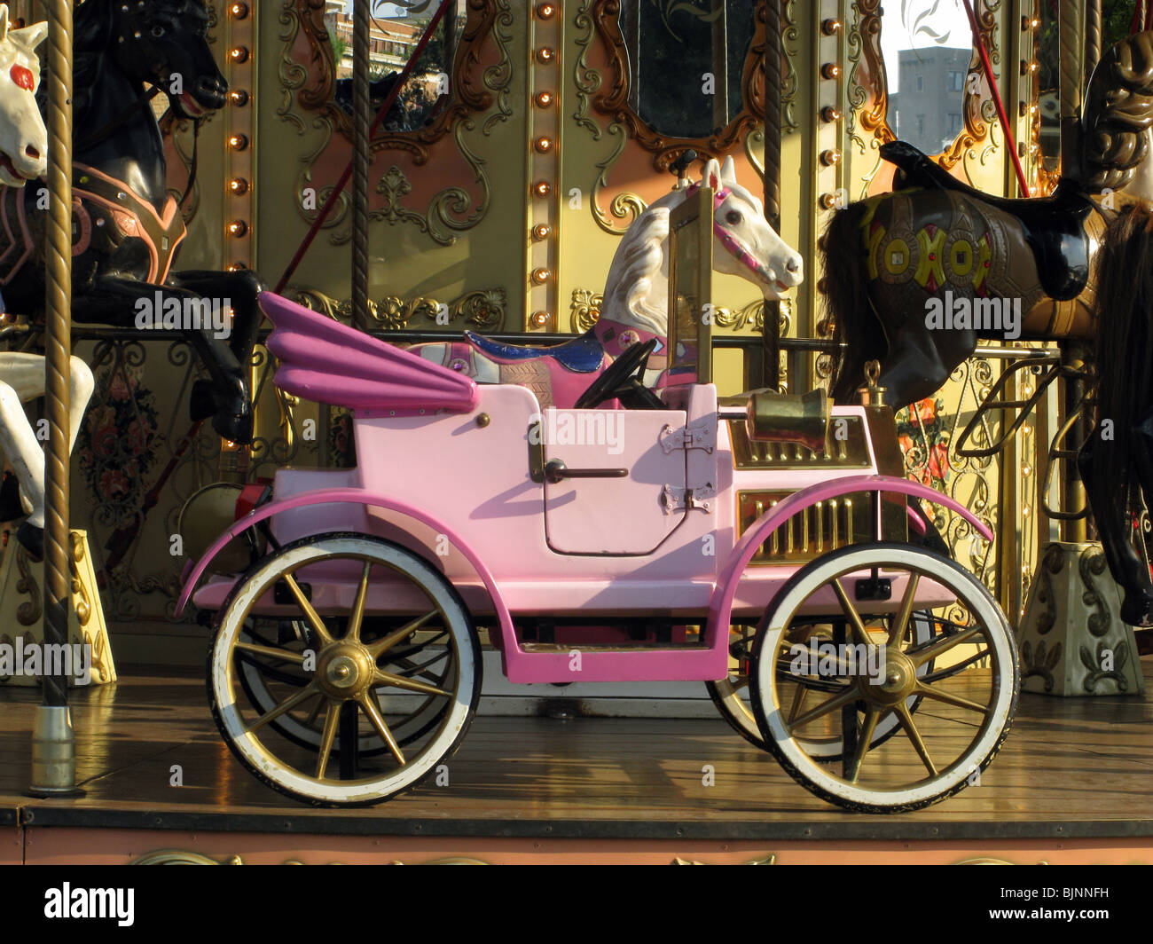 traditional fair ground carousel ride in park Stock Photo - Alamy