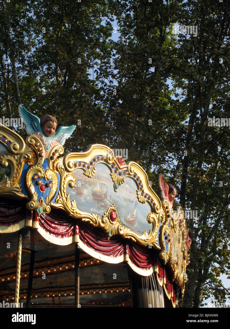 traditional fair ground carousel ride in park Stock Photo - Alamy