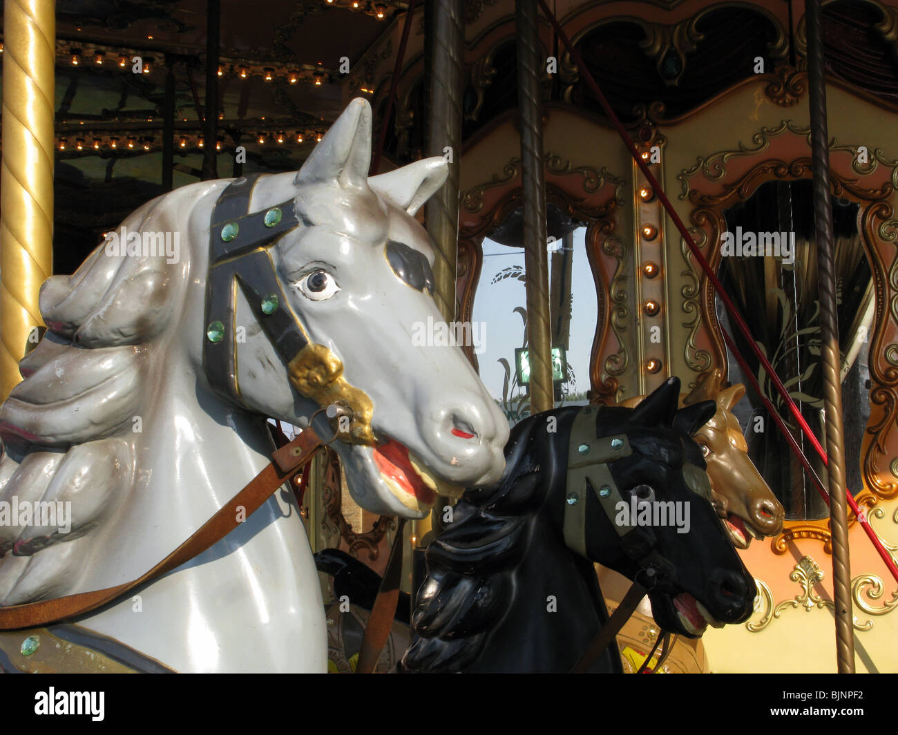 traditional fair ground carousel ride in park Stock Photo - Alamy