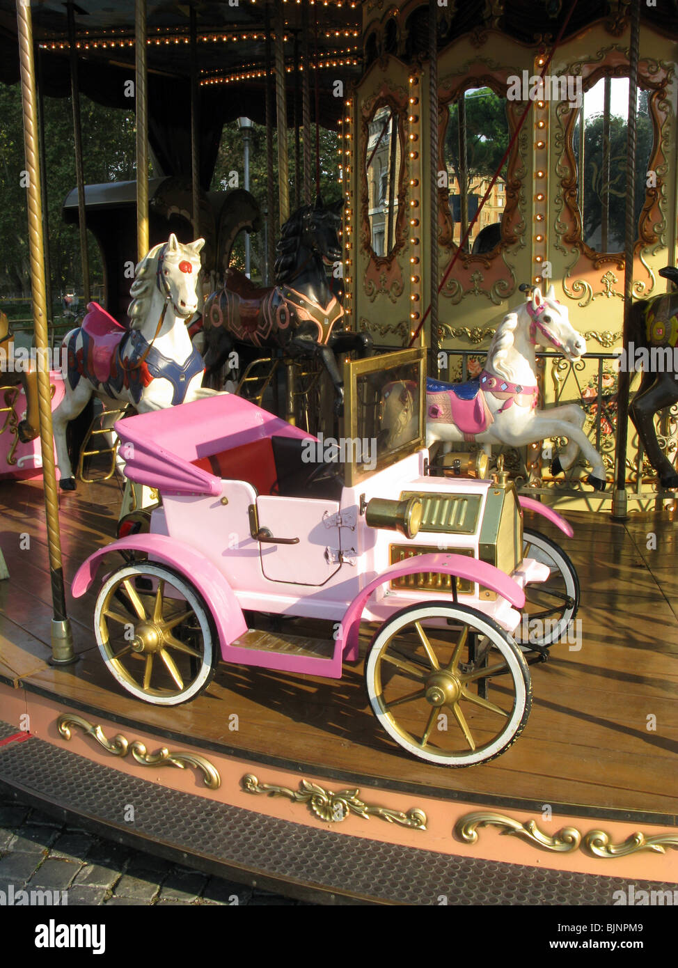 traditional fair ground carousel ride in park Stock Photo - Alamy