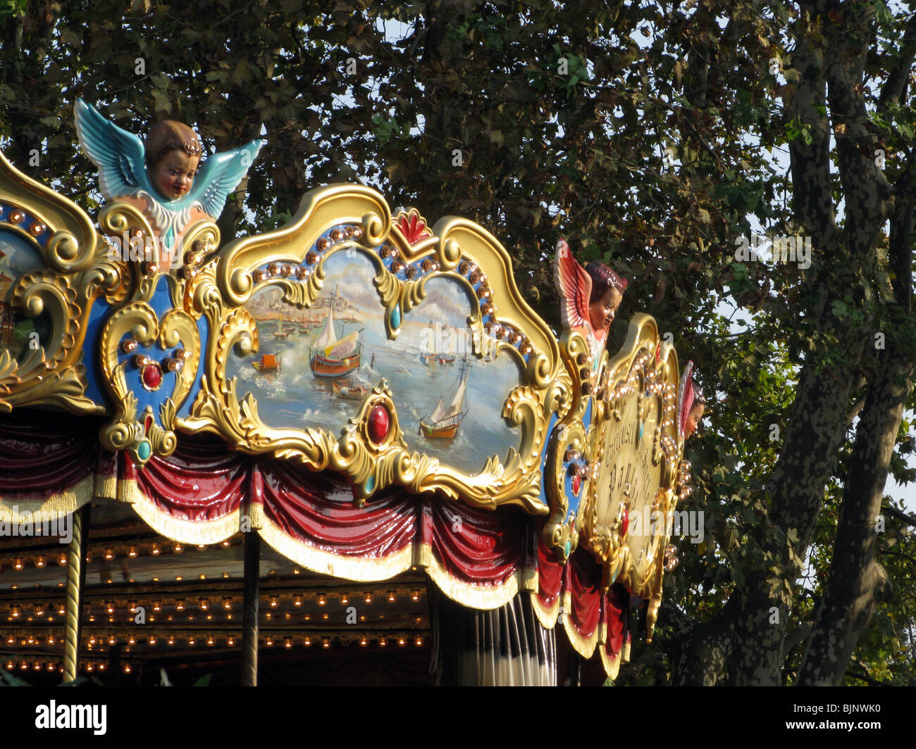 traditional fair ground carousel ride in park Stock Photo - Alamy