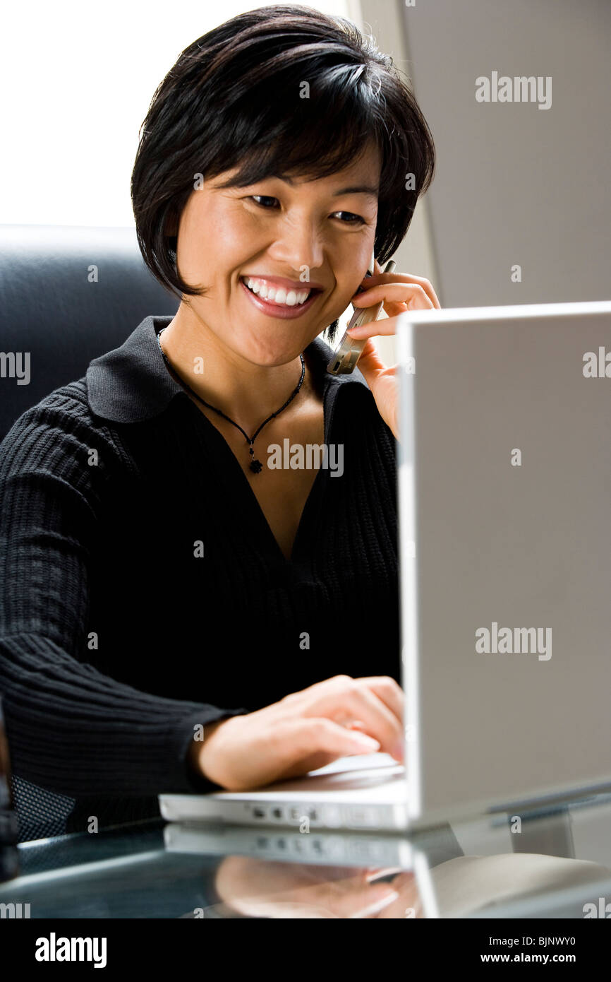 Woman reading a report Stock Photo - Alamy