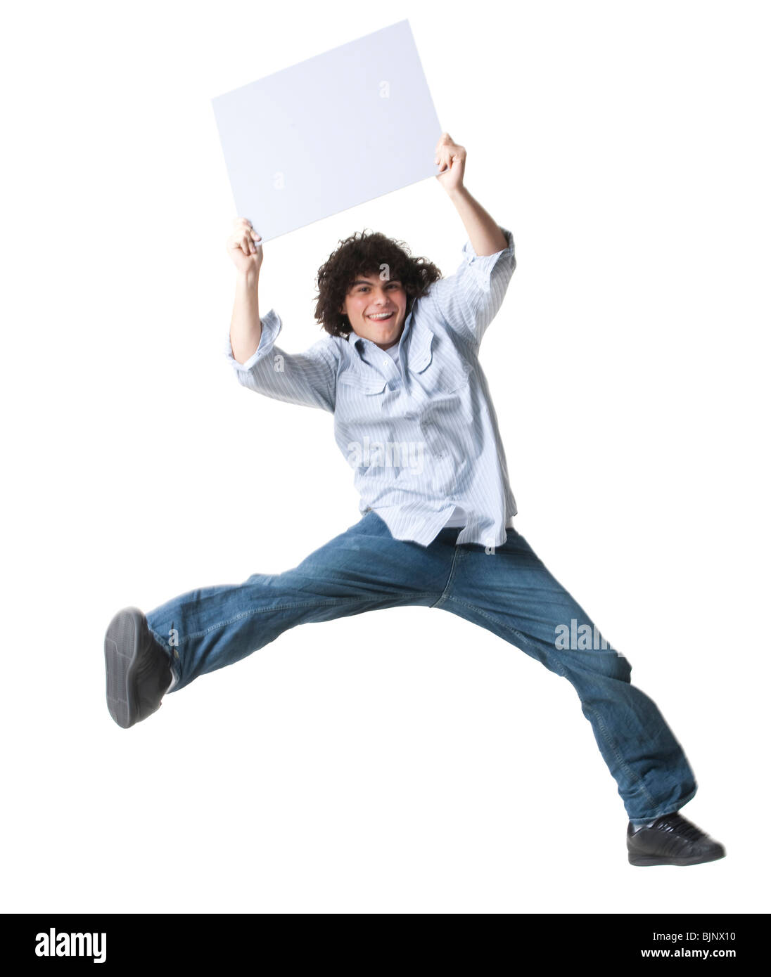 Man jumping holding blank sign Stock Photo - Alamy