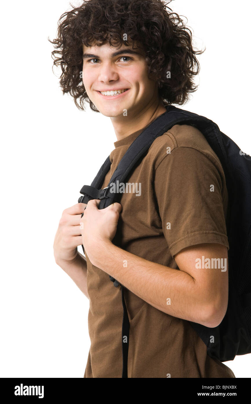 Teenage boy smiling with backpack Stock Photo - Alamy