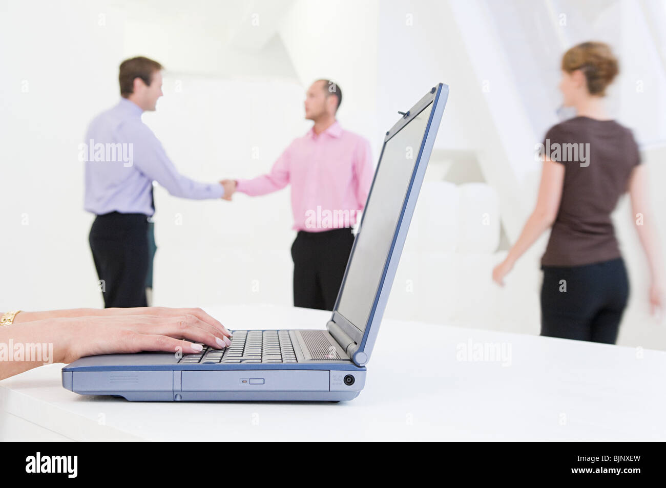 A person typing on a laptop Stock Photo - Alamy
