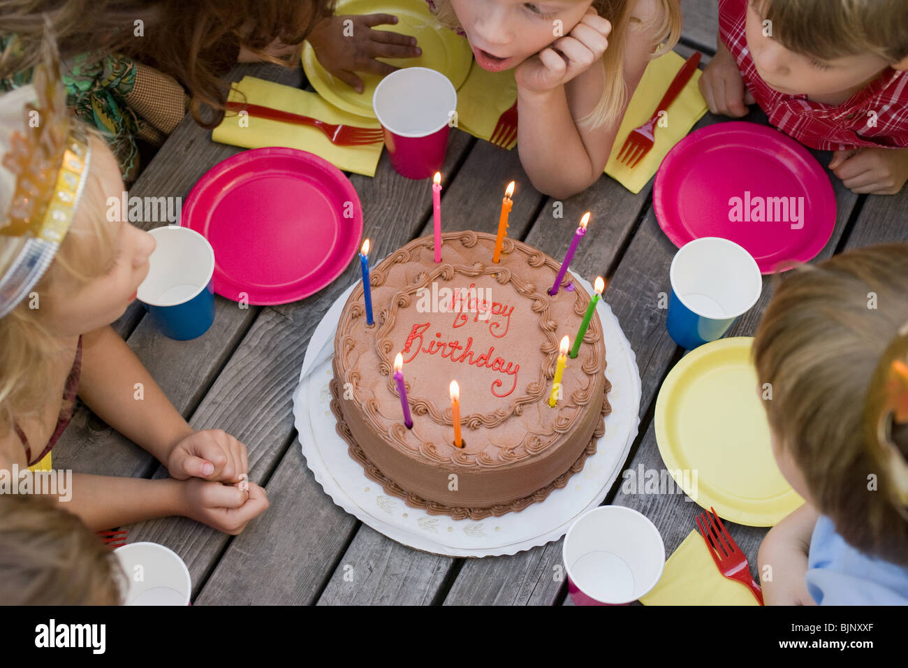 Children around birthday cake hi-res stock photography and images - Alamy