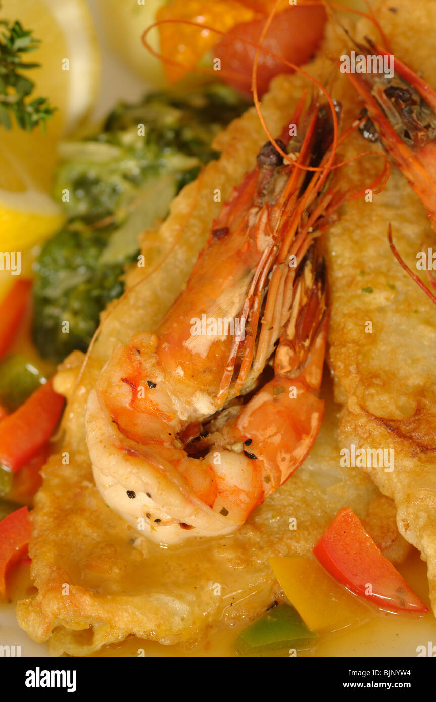 Fried sole fosh with shrimps, potatoes, lemon served at restaurant ...