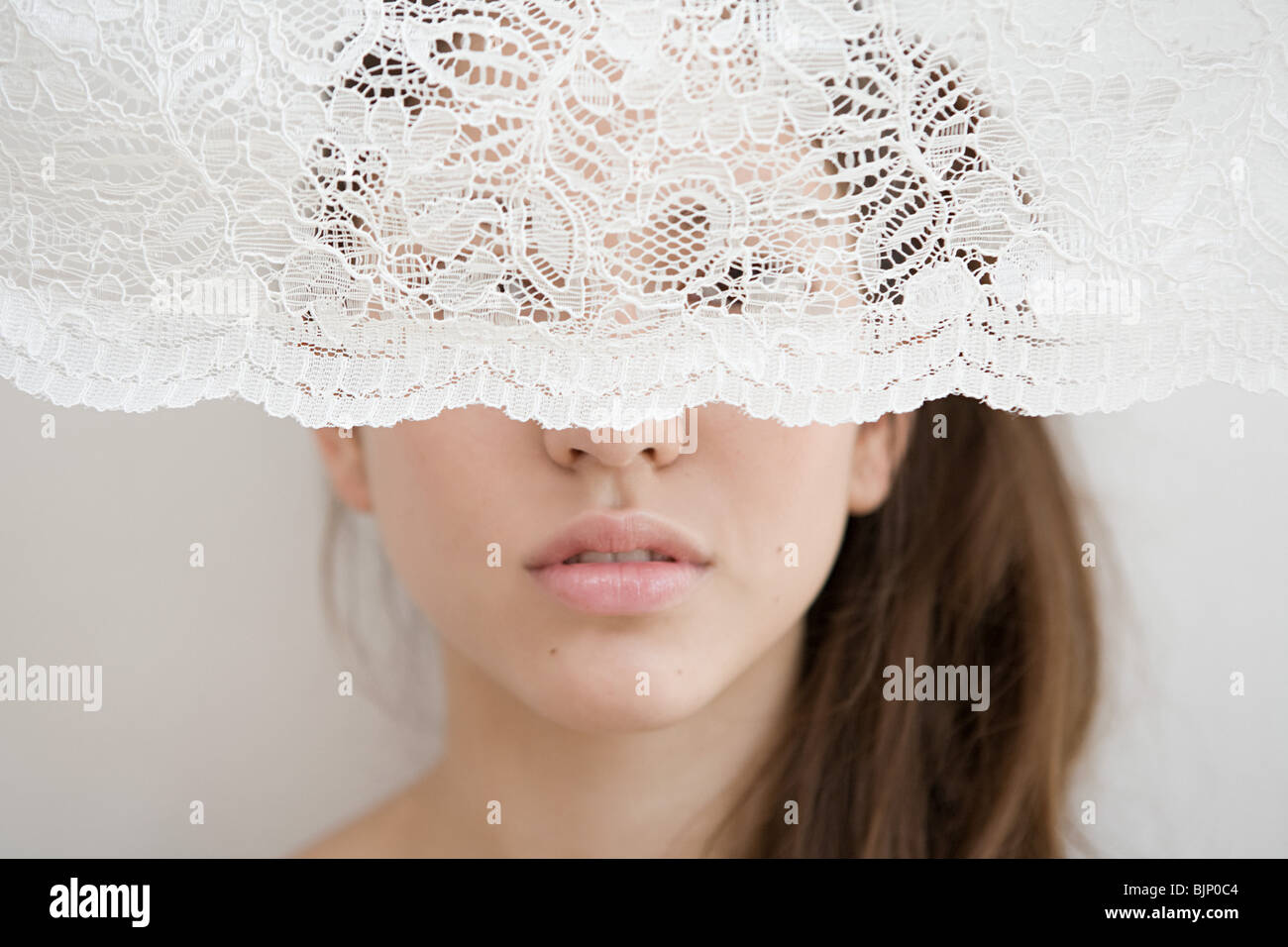 Woman behind curtain hi-res stock photography and images - Alamy
