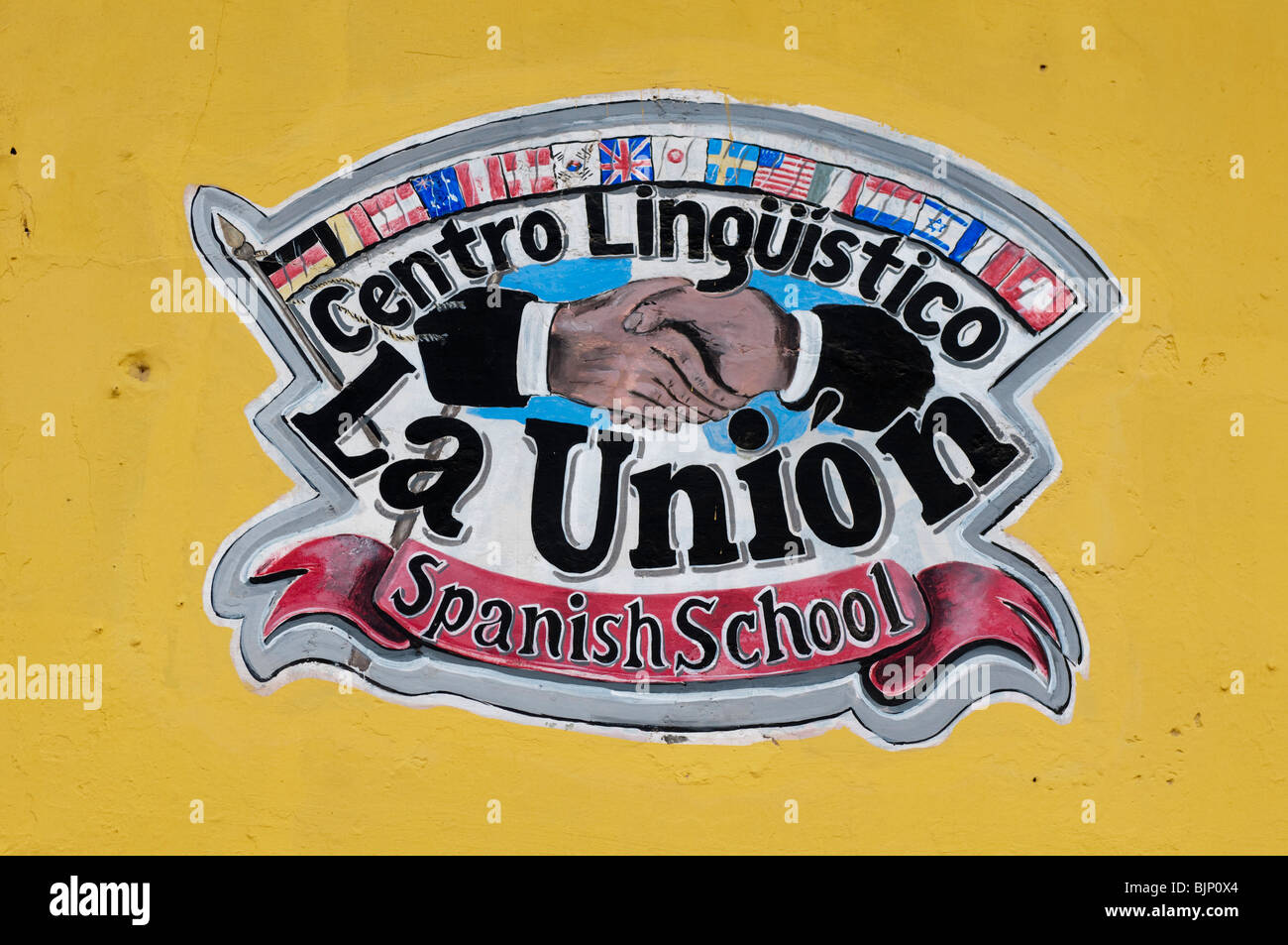 Spanish school sign, Antigua, Guatemala Stock Photo - Alamy