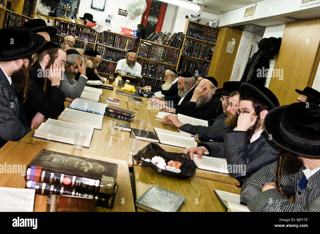 Hassidic Orthodox Jews studying the bible with their Rabi in Jerusalem ...