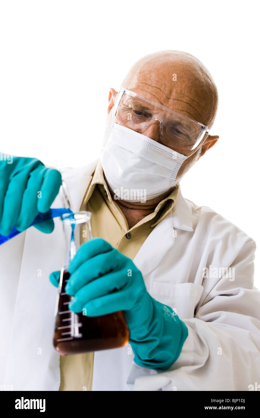 Scientist pouring chemicals into beaker Stock Photo - Alamy