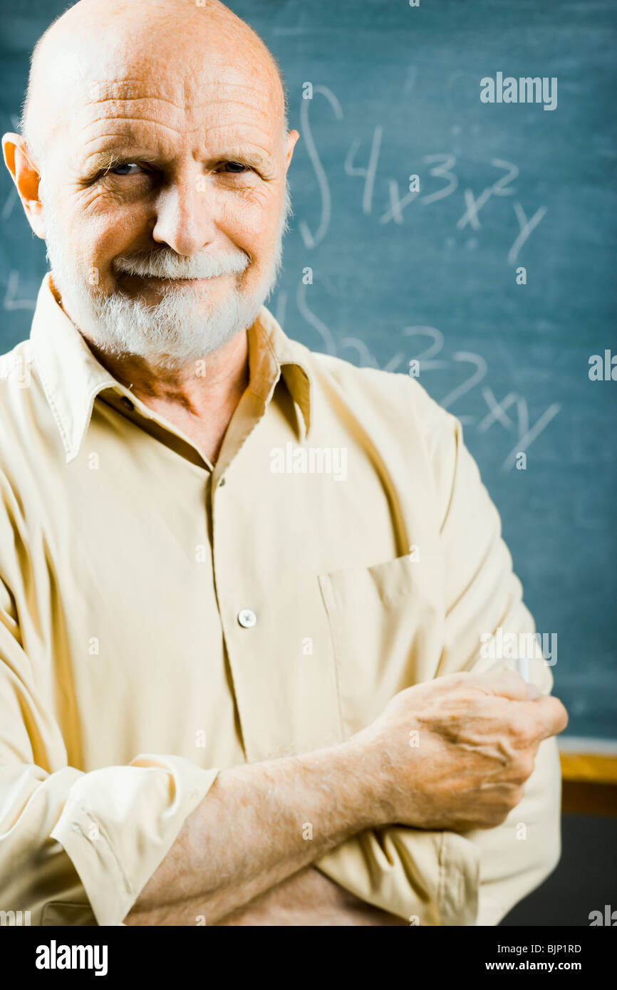 Closeup of male school teacher holding chalk Stock Photo - Alamy