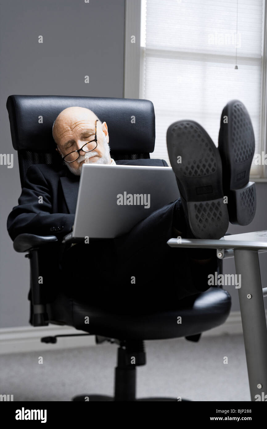 Closeup of businessman in office sleeping Stock Photo - Alamy