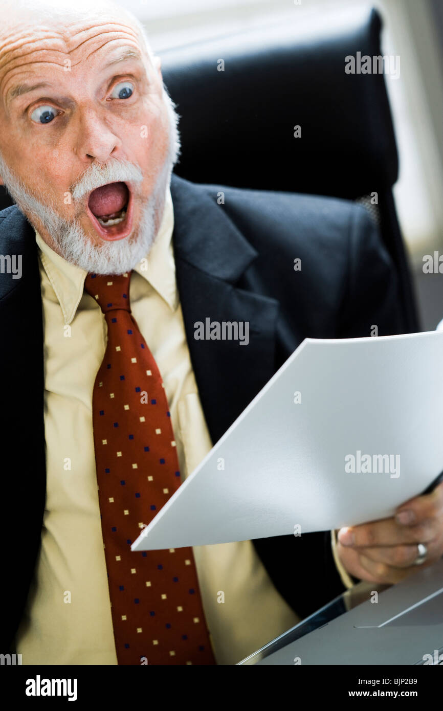 Office worker reading annual reports hi-res stock photography and ...