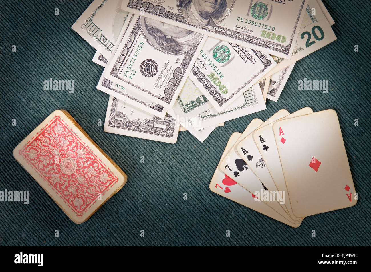poker cards with money Stock Photo - Alamy