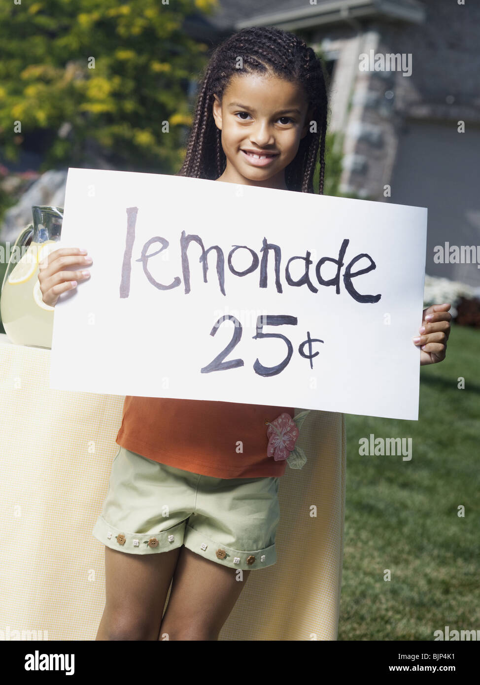 Girl selling lemonade Stock Photo - Alamy