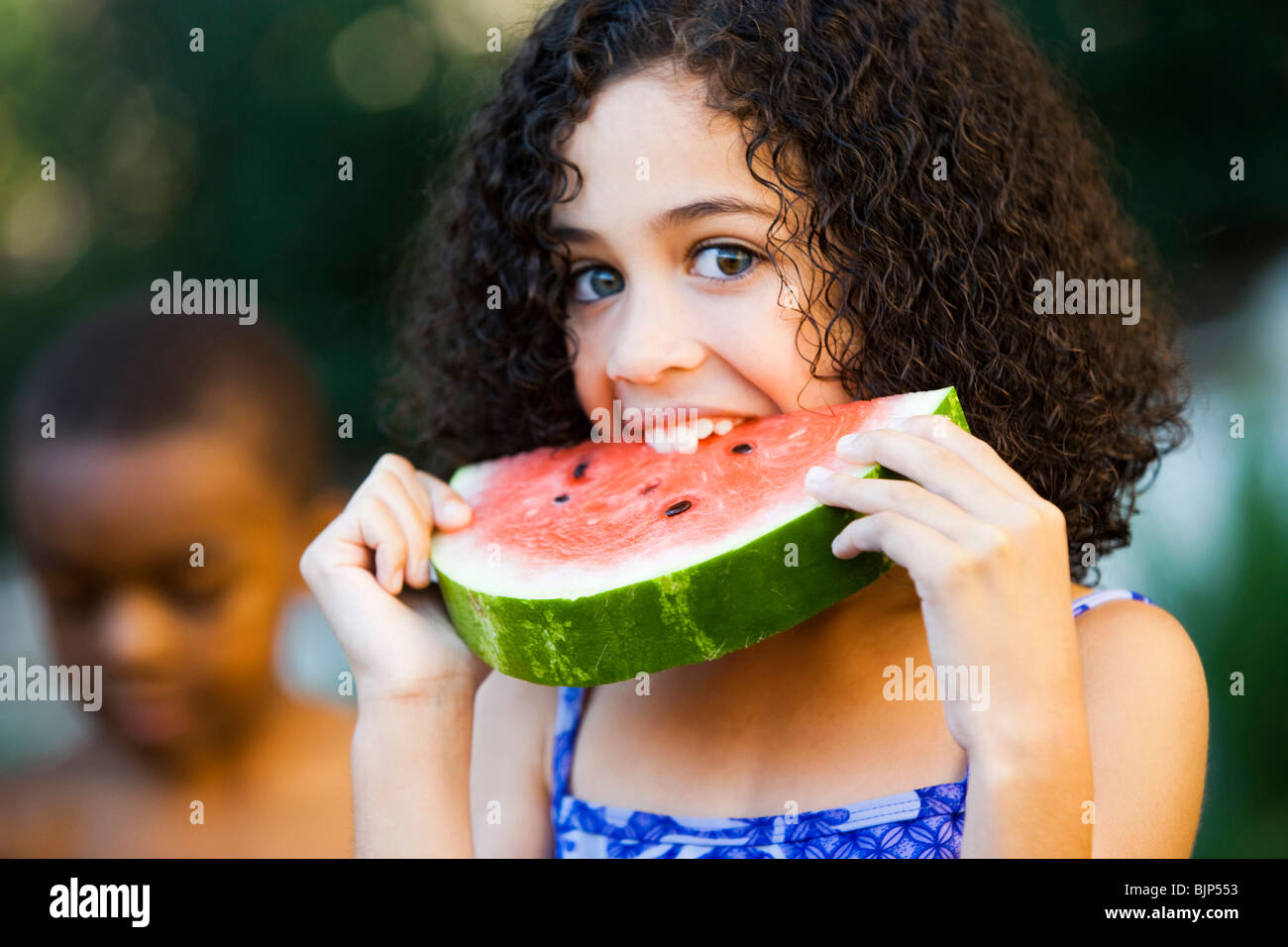 Girl eating watermelon Stock Photo - Alamy