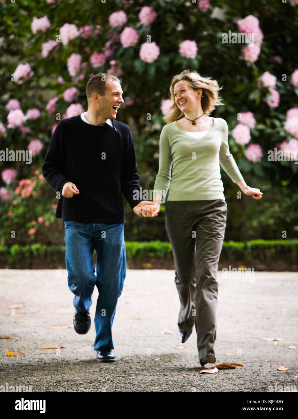 Two people running Stock Photo - Alamy