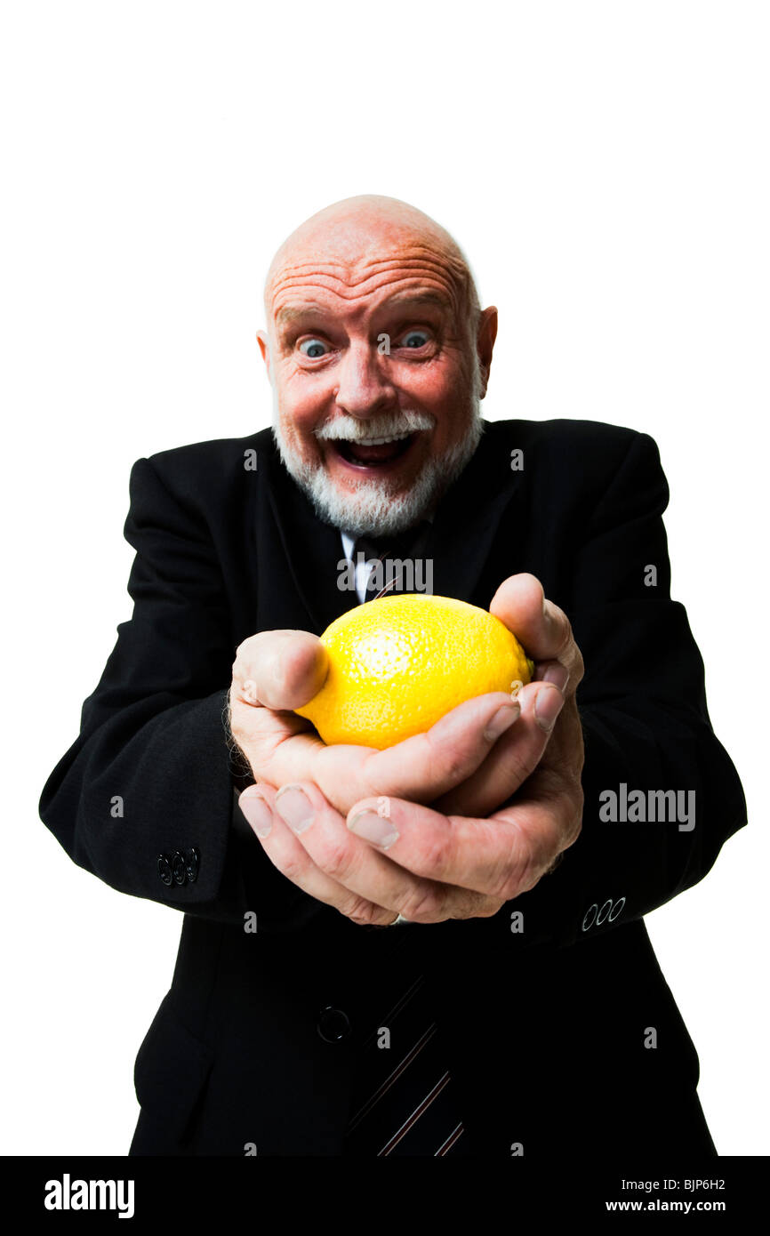 Business man holding lemon Stock Photo - Alamy