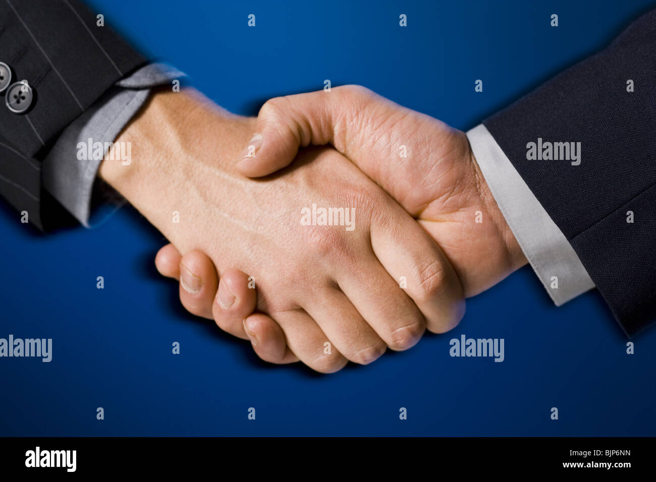 Two hands shaking Stock Photo - Alamy