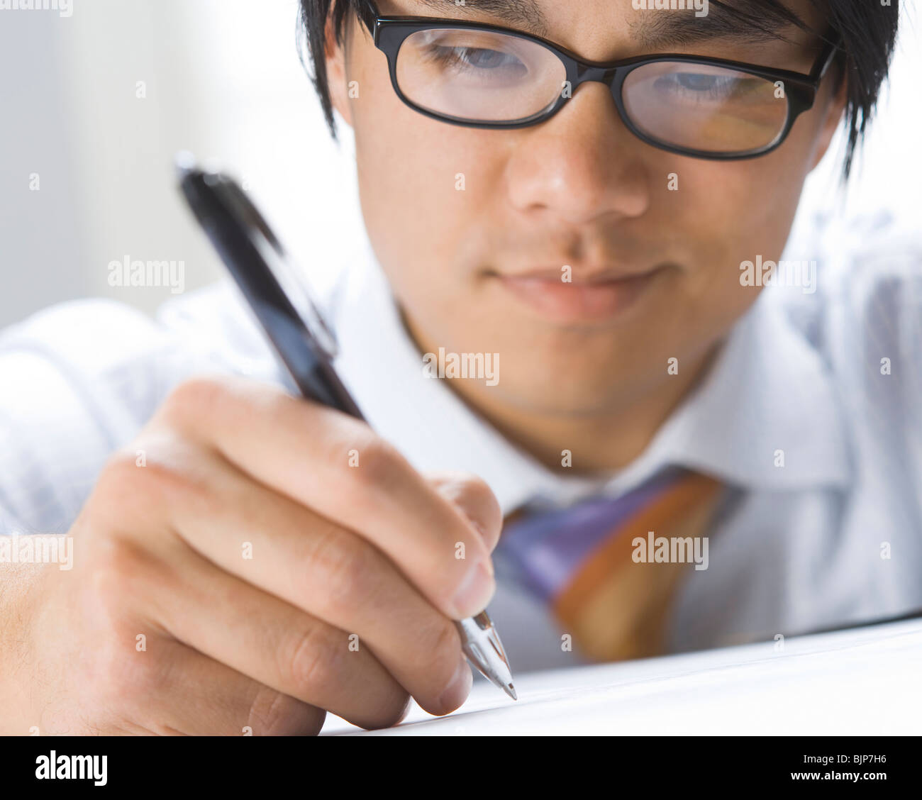 Closeup of man writing Stock Photo - Alamy