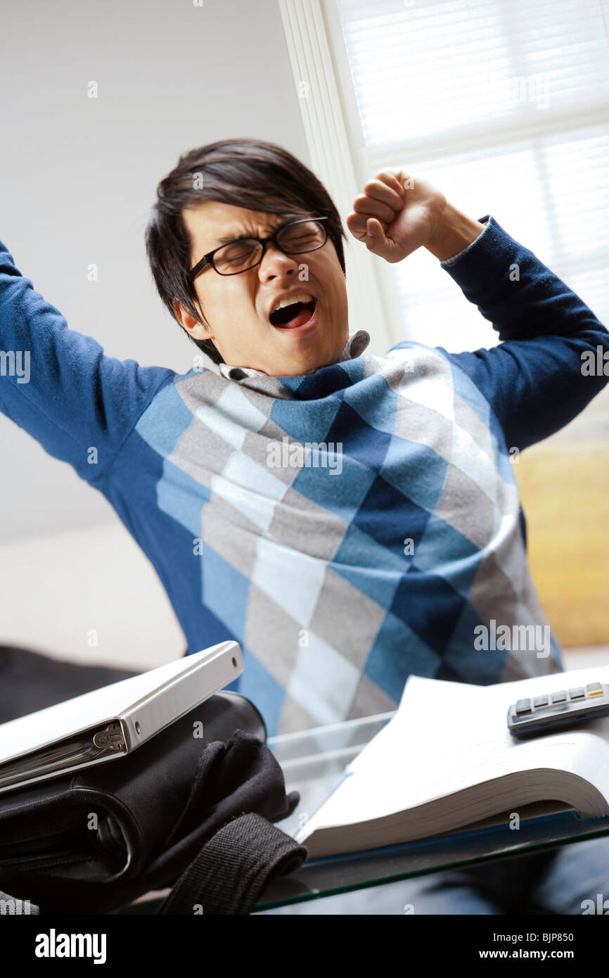 Close up of student yawning Stock Photo - Alamy