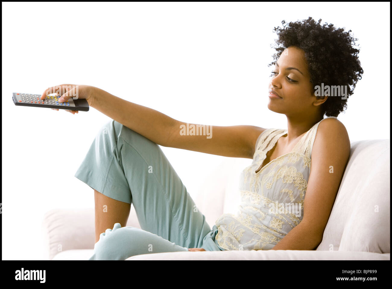 Woman Alone Hold Tv Remote High Resolution Stock Photography and Images ...