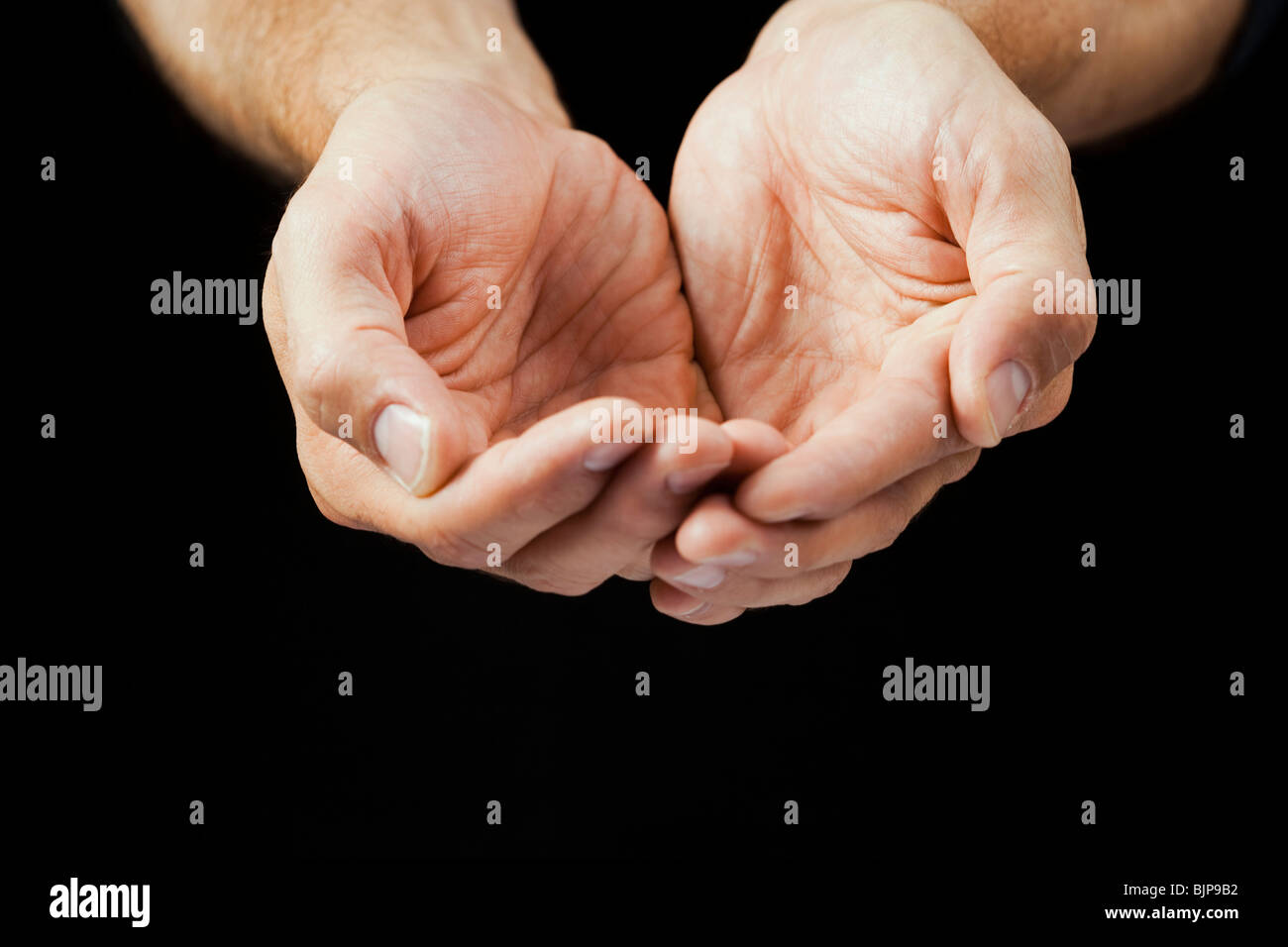Closeup of cupped hands Stock Photo - Alamy