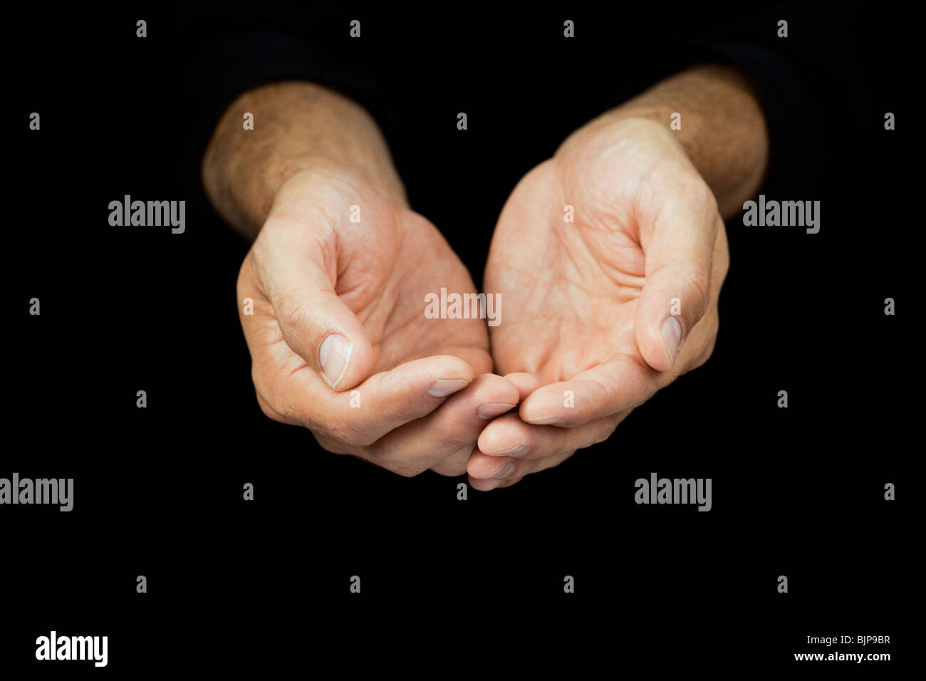 Closeup of cupped hands Stock Photo - Alamy