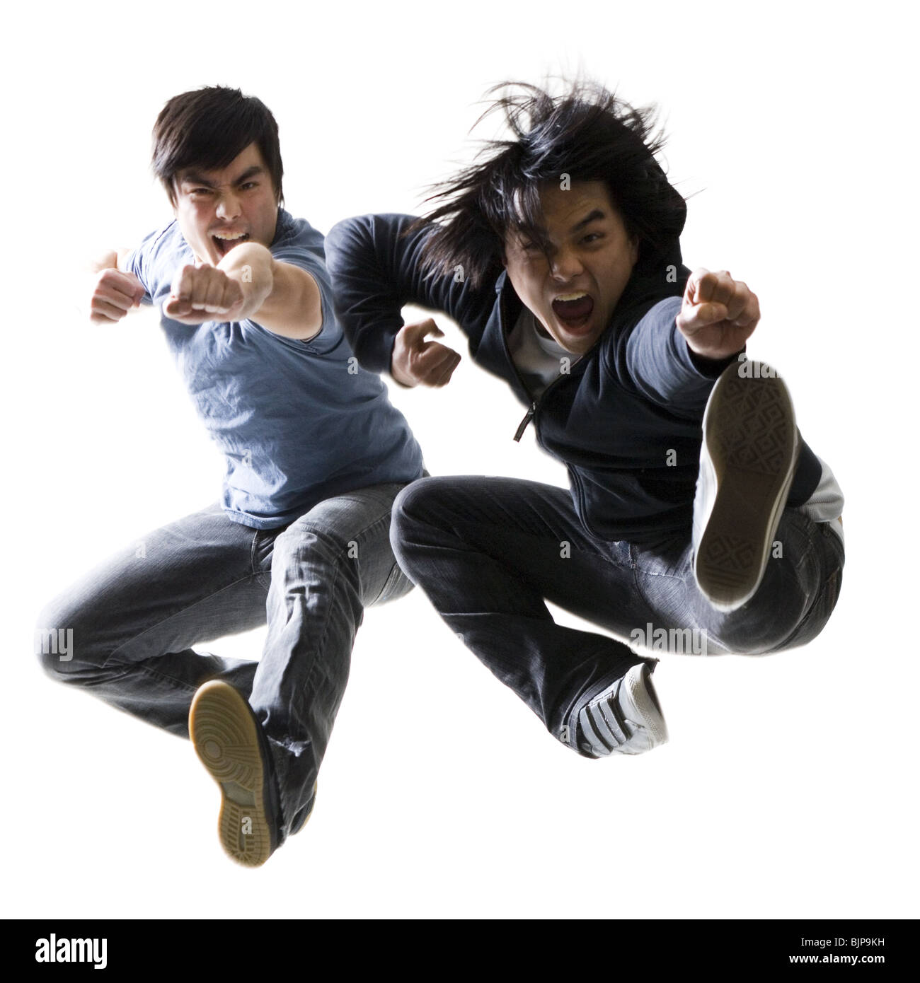 Young adult men jumping Stock Photo - Alamy