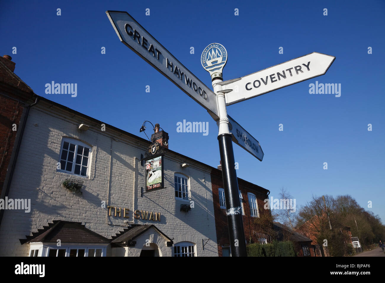 Canal signpost on the towpath beside The Swan public house, Fradley ...