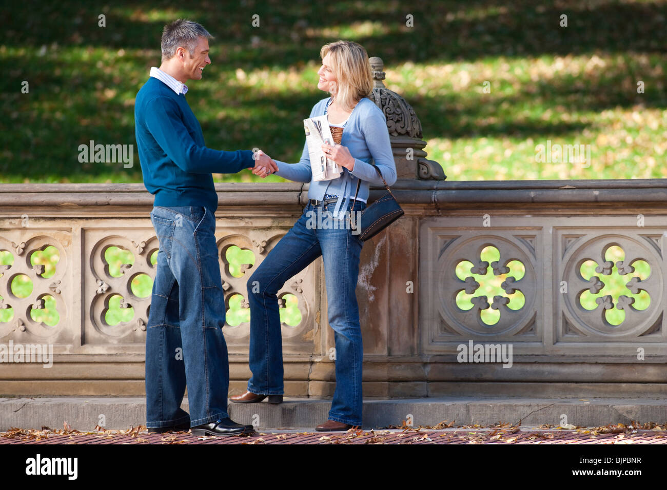 Man and woman smiling Stock Photo - Alamy