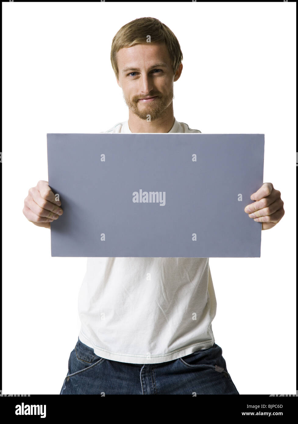 Man holding a blank sign Stock Photo - Alamy