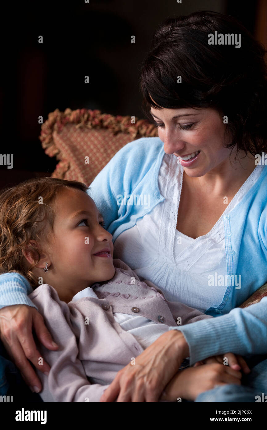 Mother embracing daughter Stock Photo - Alamy