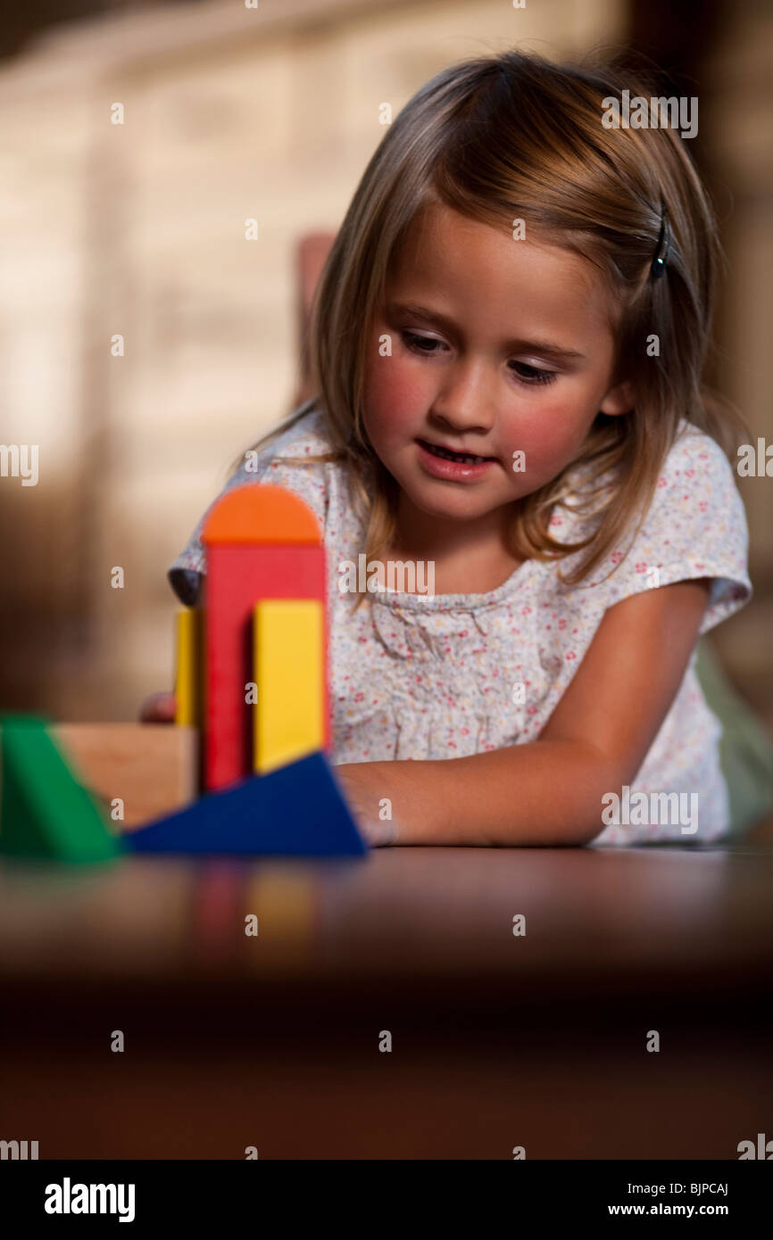 Girl playing with blocks Stock Photo - Alamy