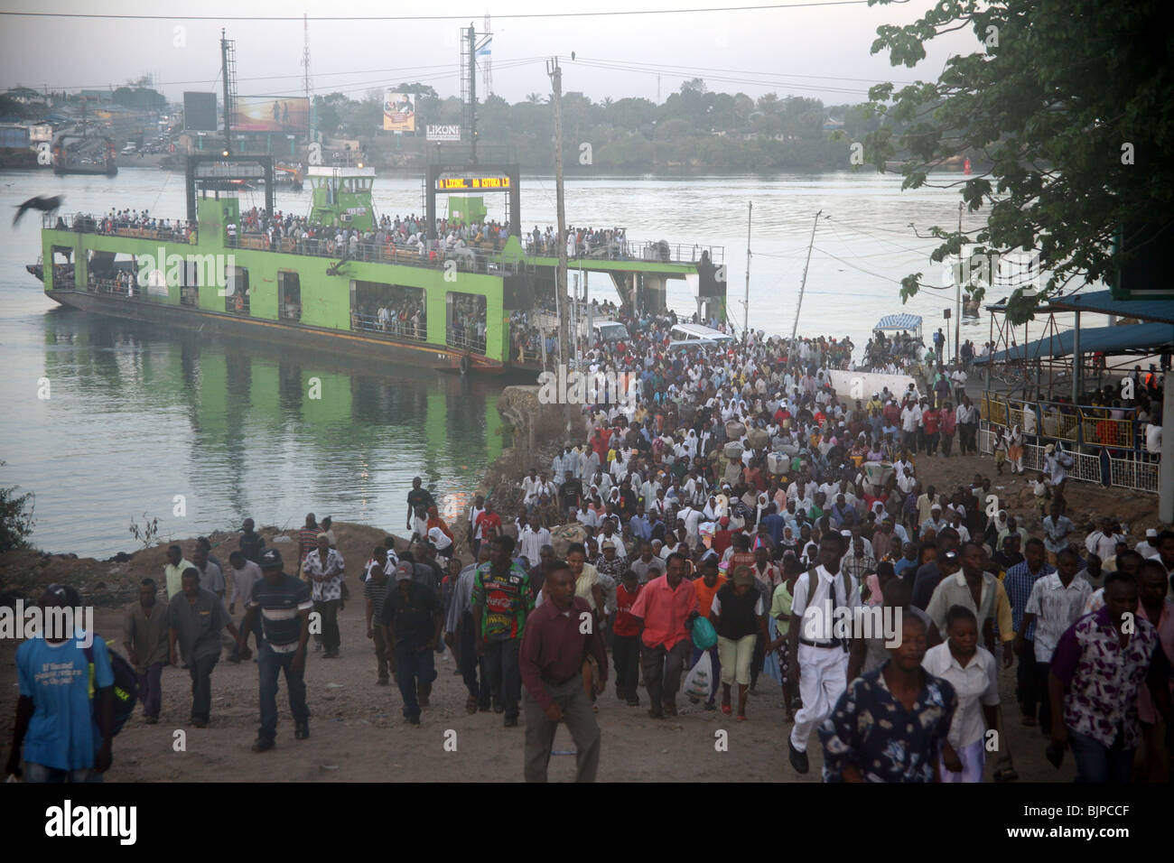 Vehicles and passengers disembarking from The MV Kilindini Ferry at ...
