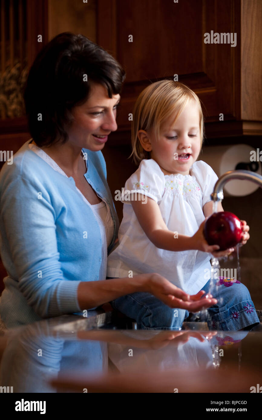 Mother and daughter washing hands Stock Photo - Alamy Mother and daughter washing hands Stock Photo - Alamy