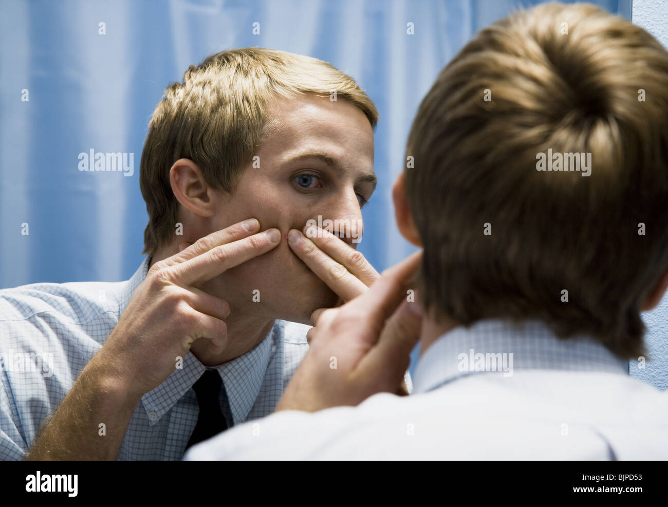 Male grooming himself Stock Photo - Alamy