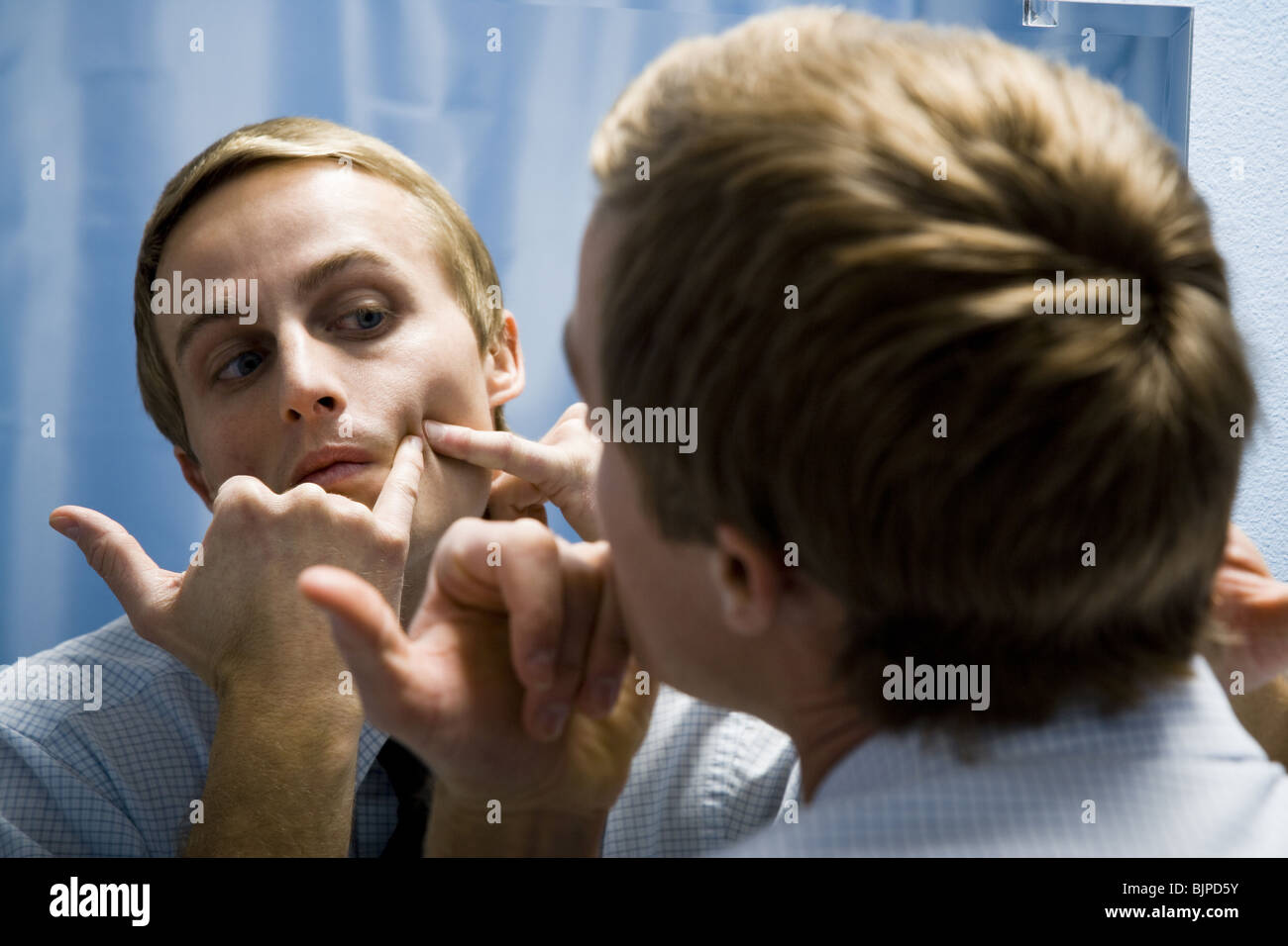 Male grooming himself Stock Photo - Alamy