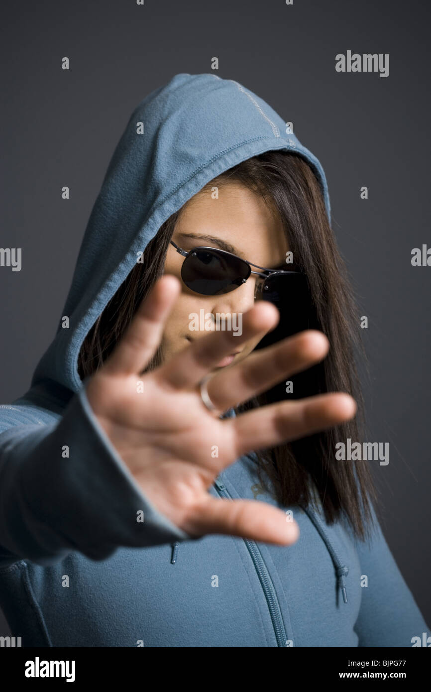 Woman hiding face sunglasses hi-res stock photography and images - Alamy