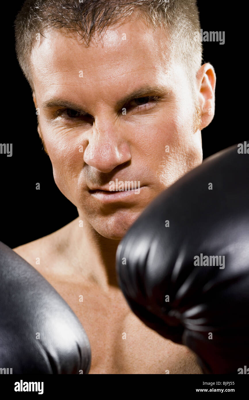 Portrait male boxer punching camera hi-res stock photography and images ...