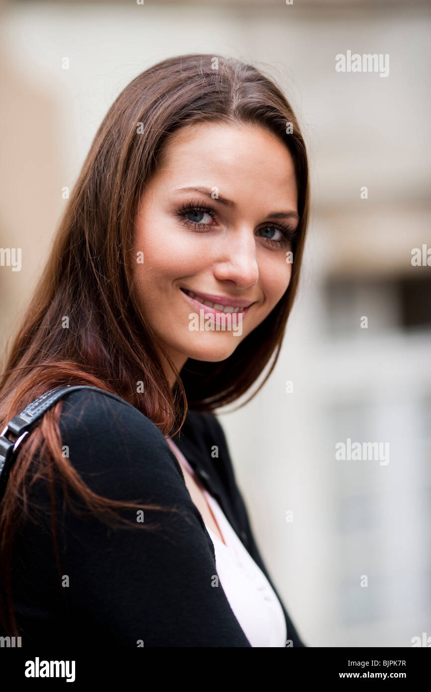 Woman posing and smiling Stock Photo - Alamy