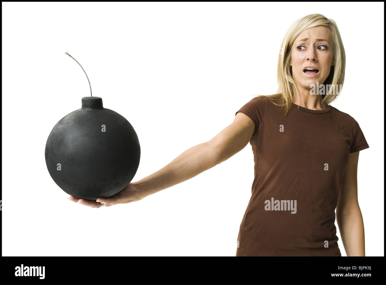 Woman posing and holding bomb Stock Photo - Alamy