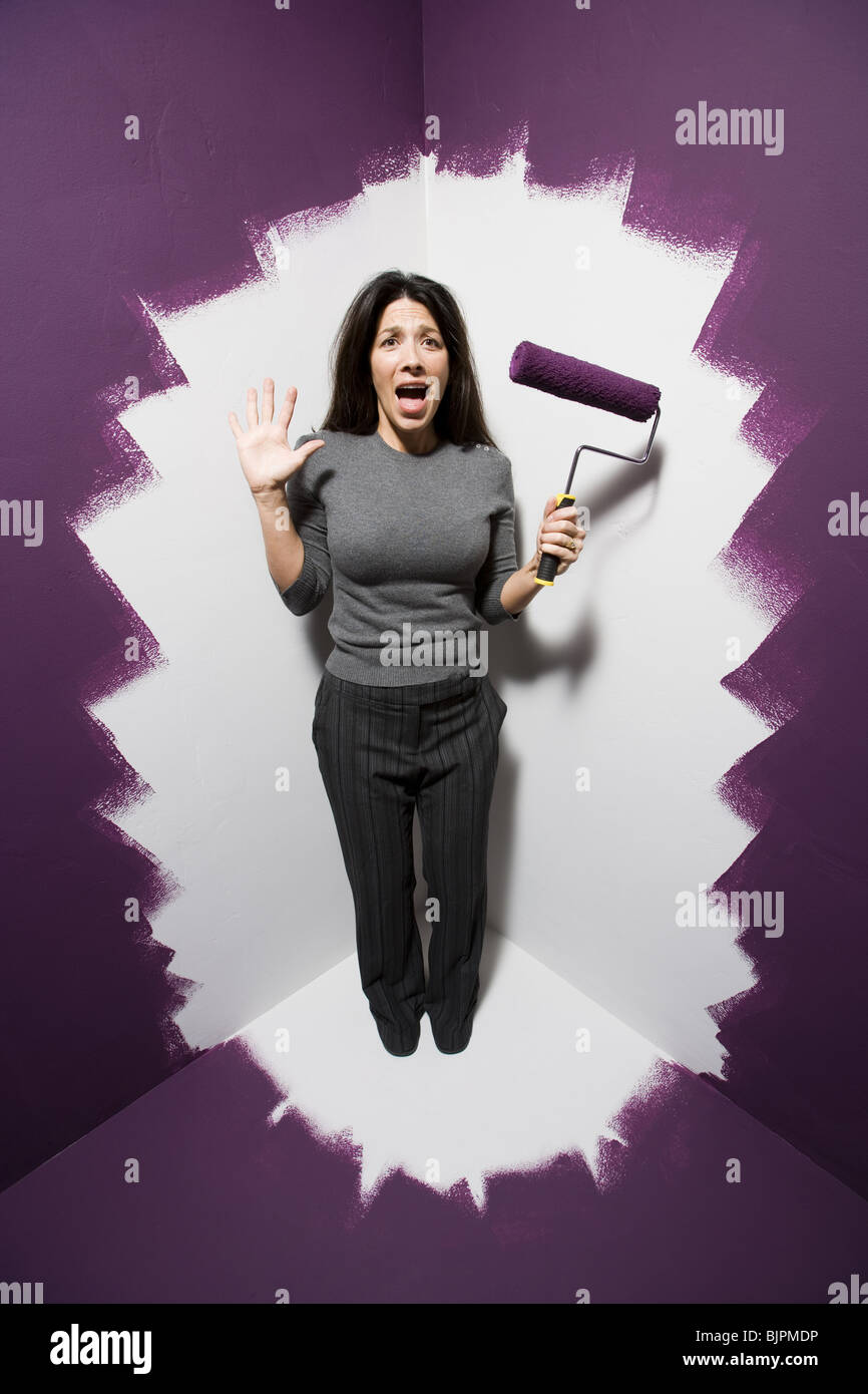 Woman painted into a corner Stock Photo - Alamy