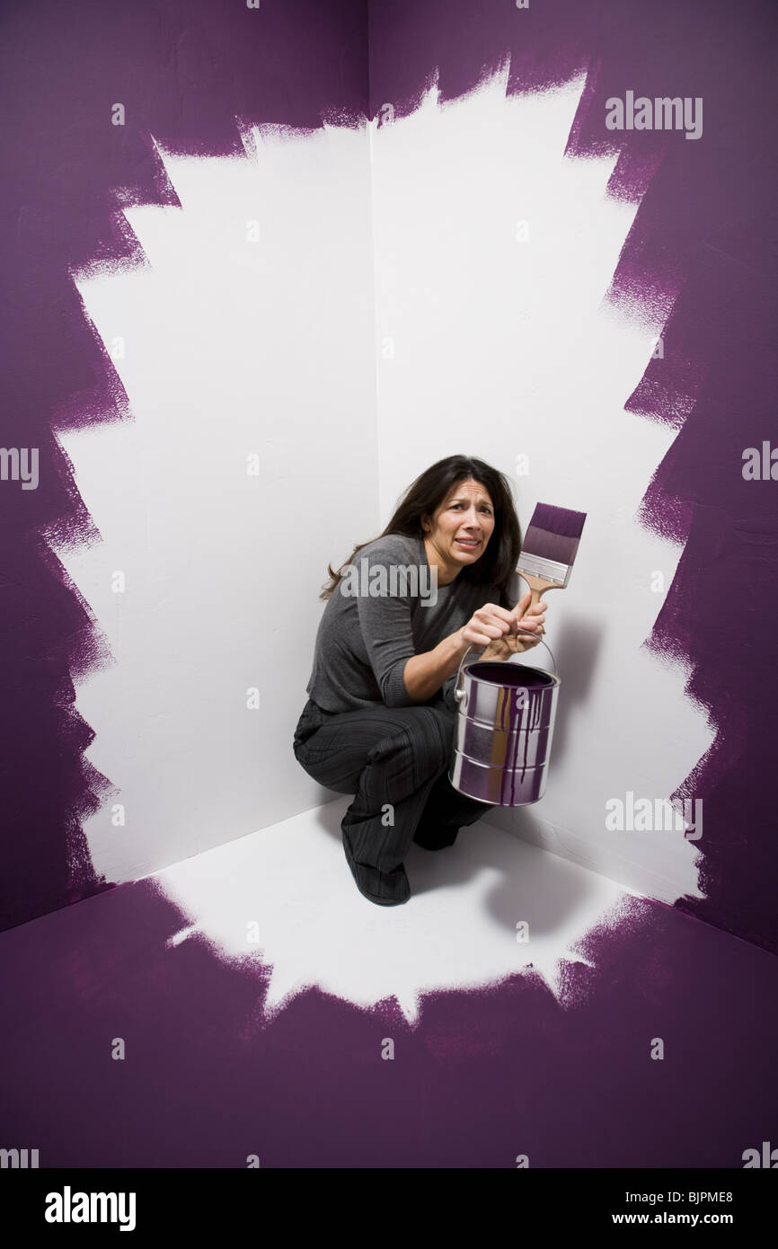 Woman painted into a corner Stock Photo - Alamy