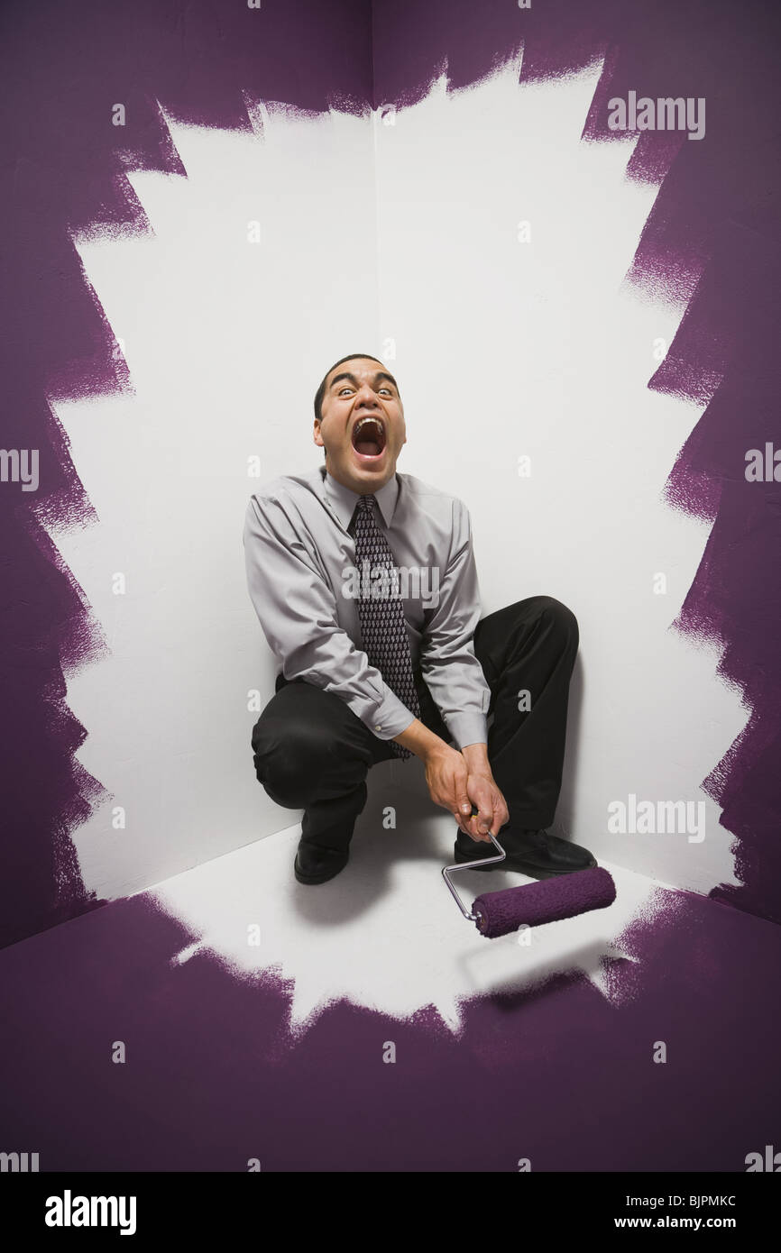 Man crouched painting hi-res stock photography and images - Alamy