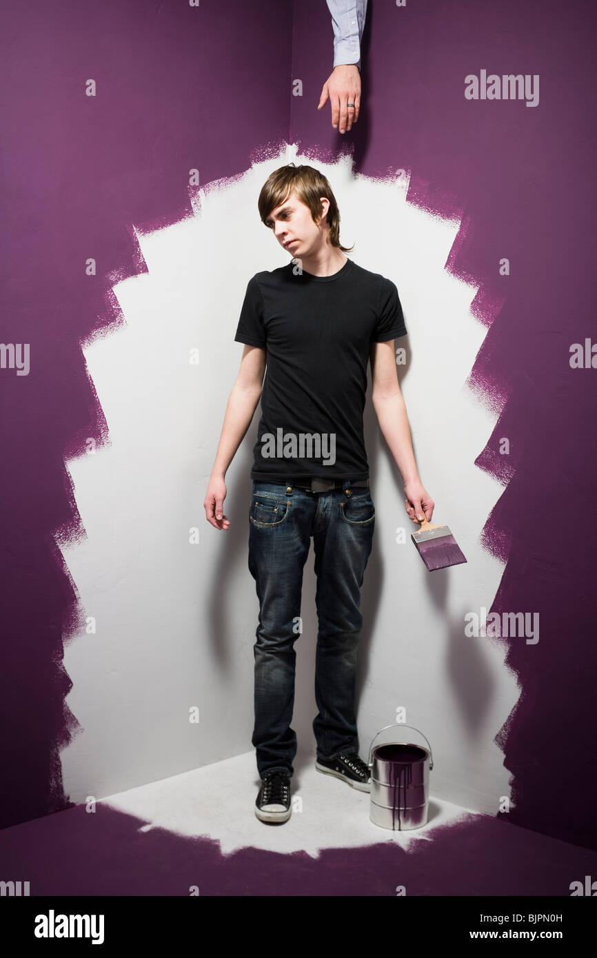 Teenage boy climbing a ladder Stock Photo - Alamy