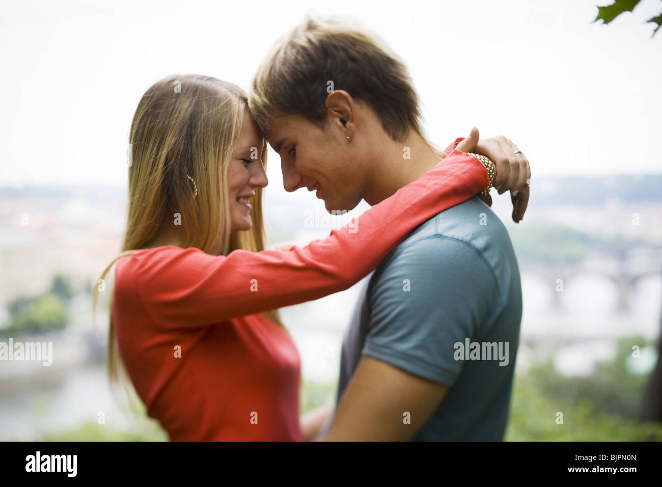 Affectionate couple with scenic background Stock Photo - Alamy