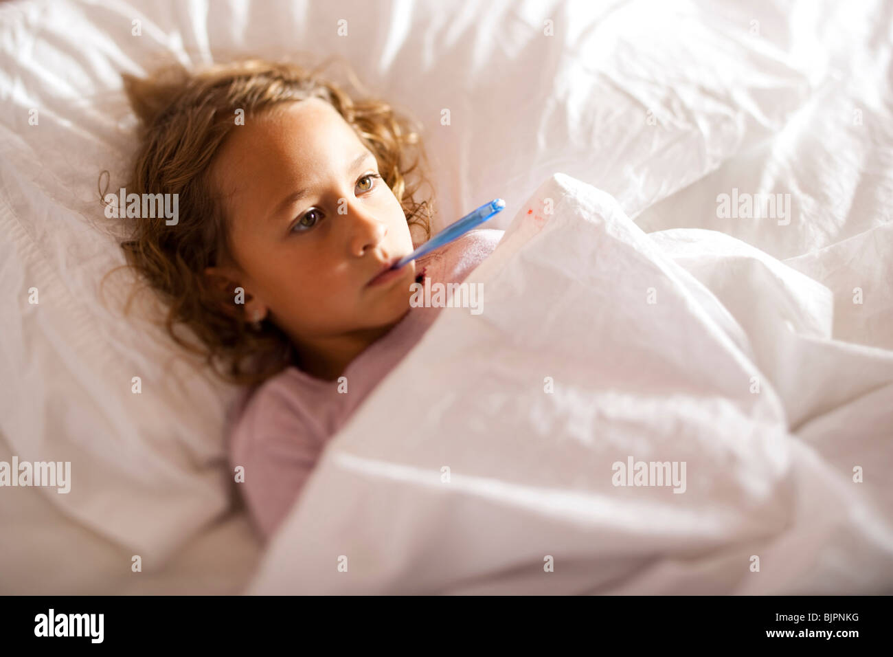 Little girl with fever Stock Photo - Alamy