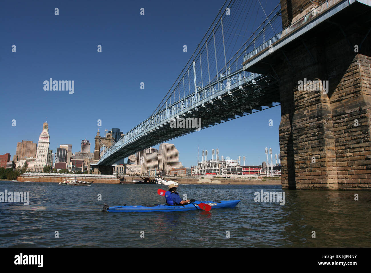 kayaker Roebling suspension bridge Ohio river downtown Cincinnati ...